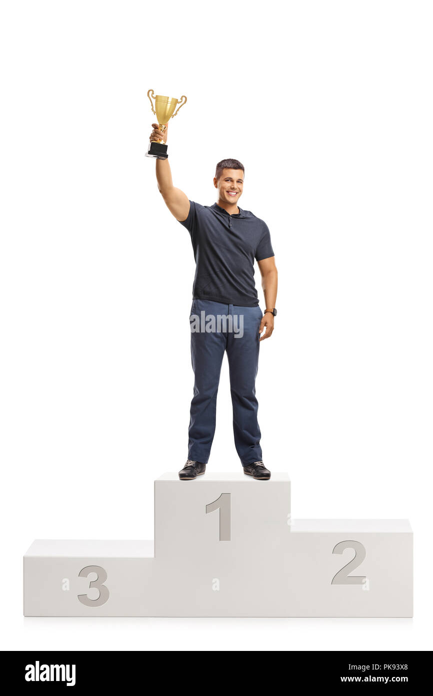 Full length portrait of a young man with a golden trophy standing on a ...