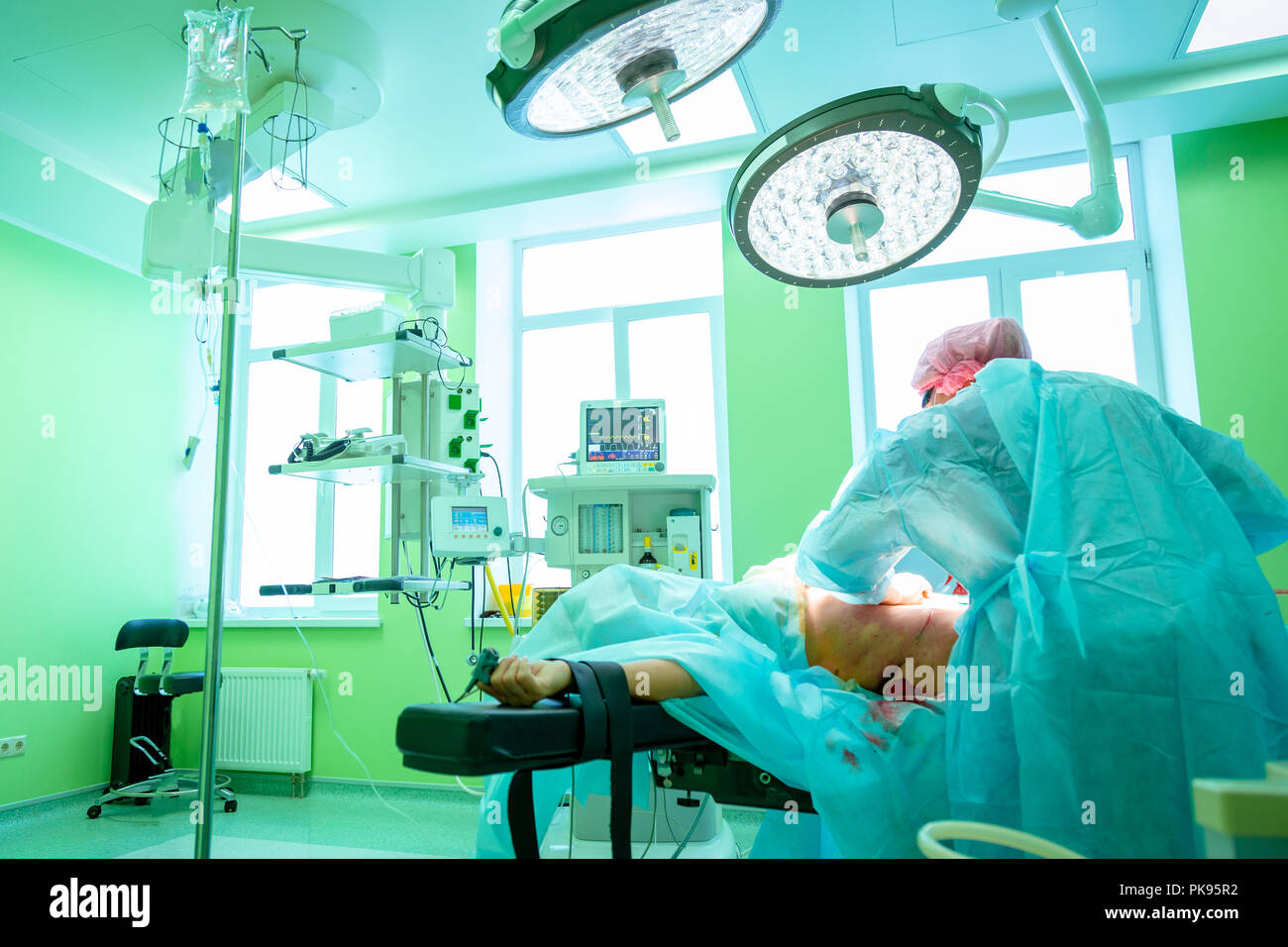 Surgical operation abdominoplasty. Surgical removal of fat tissue from ...