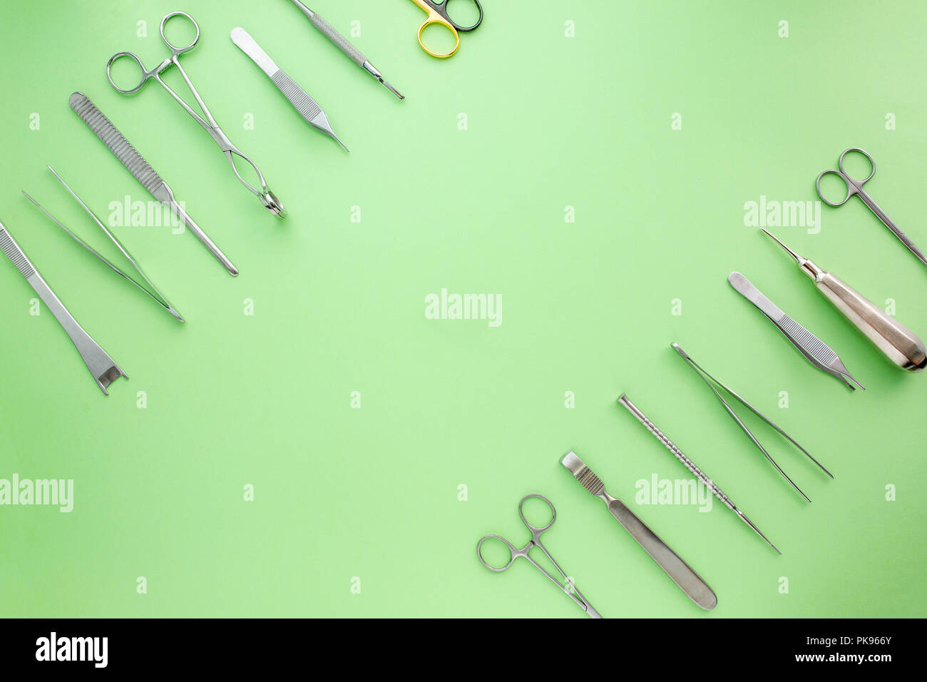 Medical equipments including surgical instruments on a green background ...