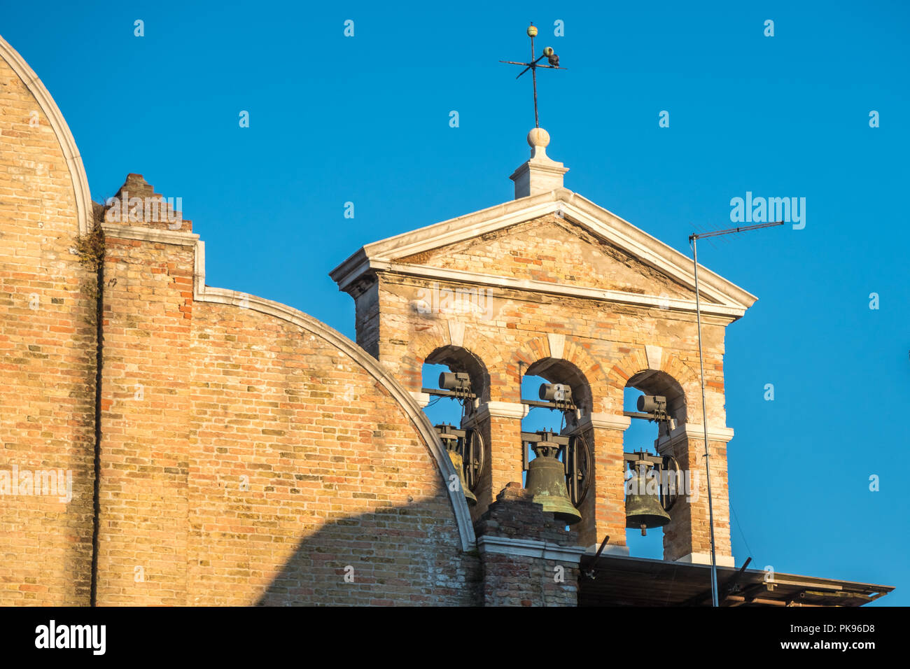 red brick bell tower with three metal bells in Venice, Italy Stock ...