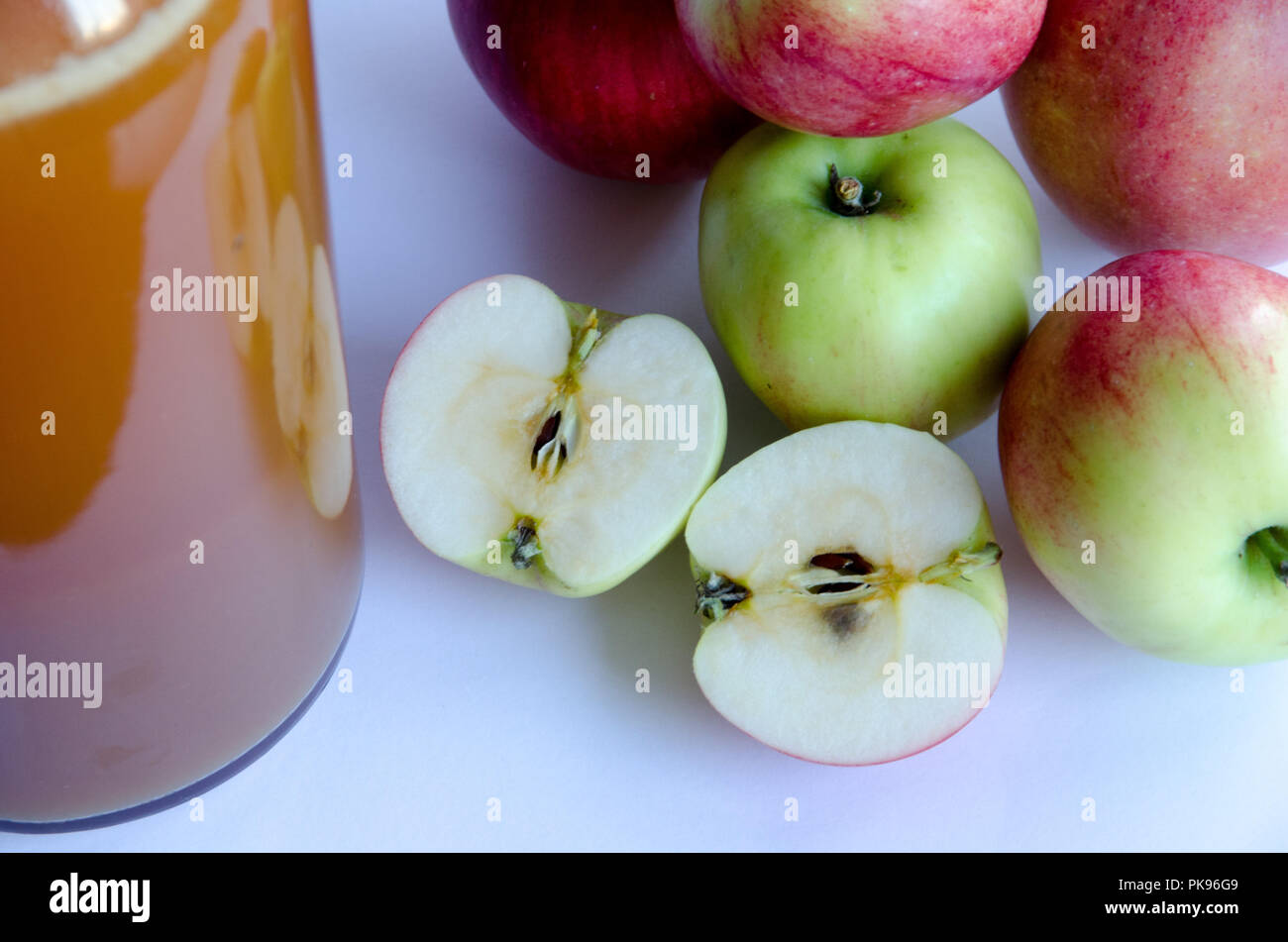 Apple sap with the main ingredient on a white background. Closeup of of ...