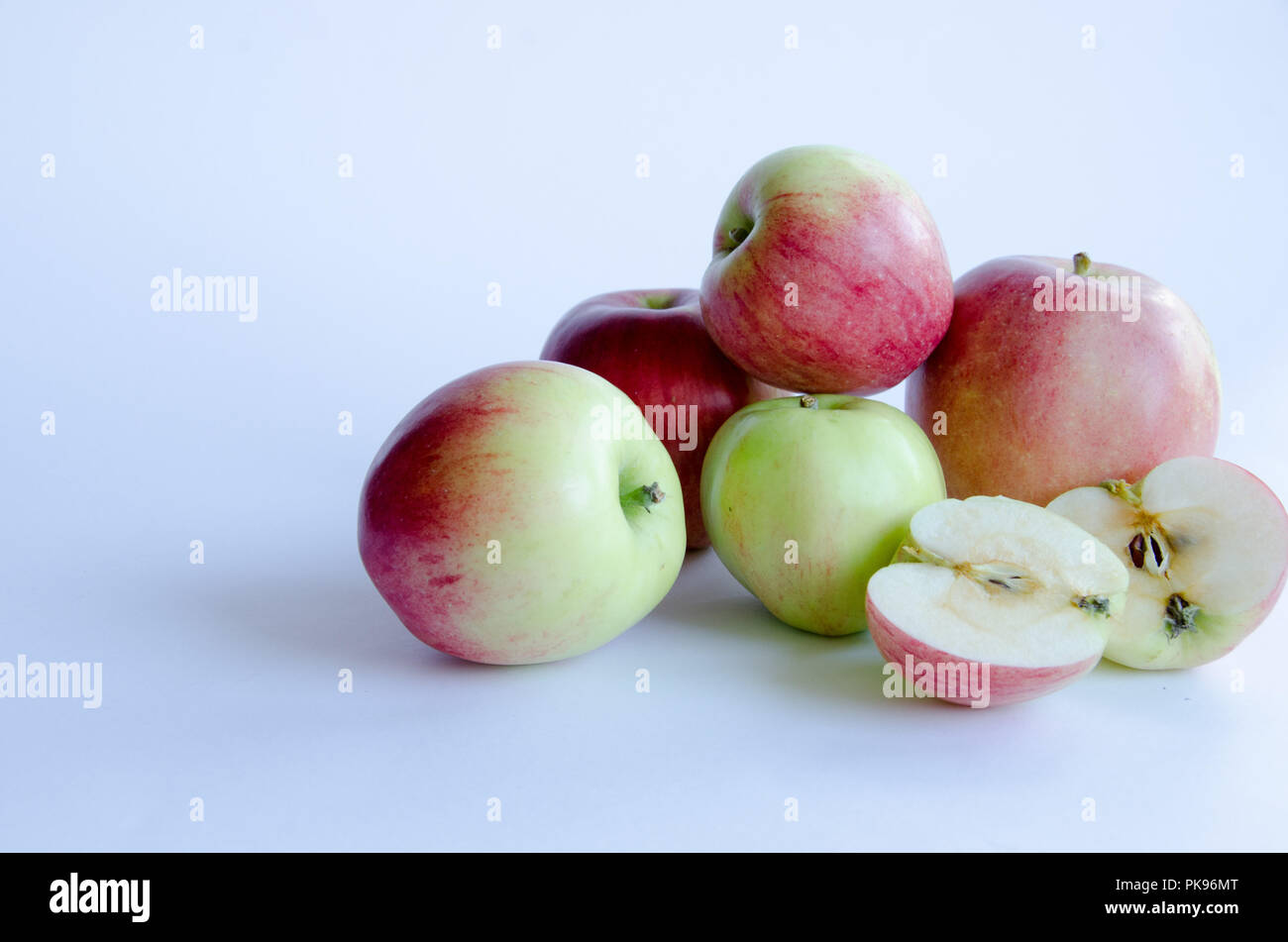 Apples in group on a white background Stock Photo - Alamy