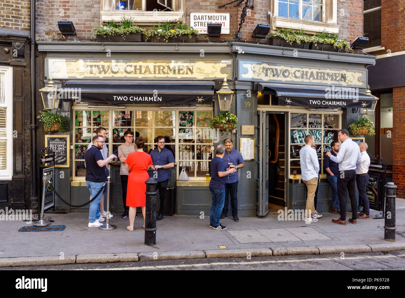 People drinking outside Two Chairmen pub in Westminster, London England ...