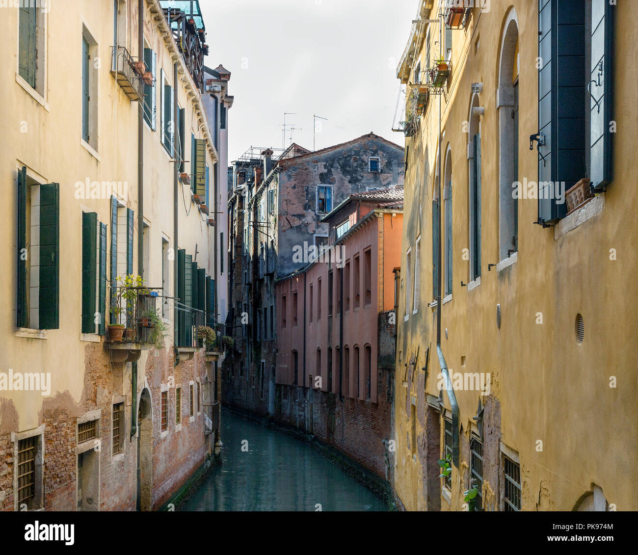 Canal in Venice with old brick buildings on each side, Italy Stock ...