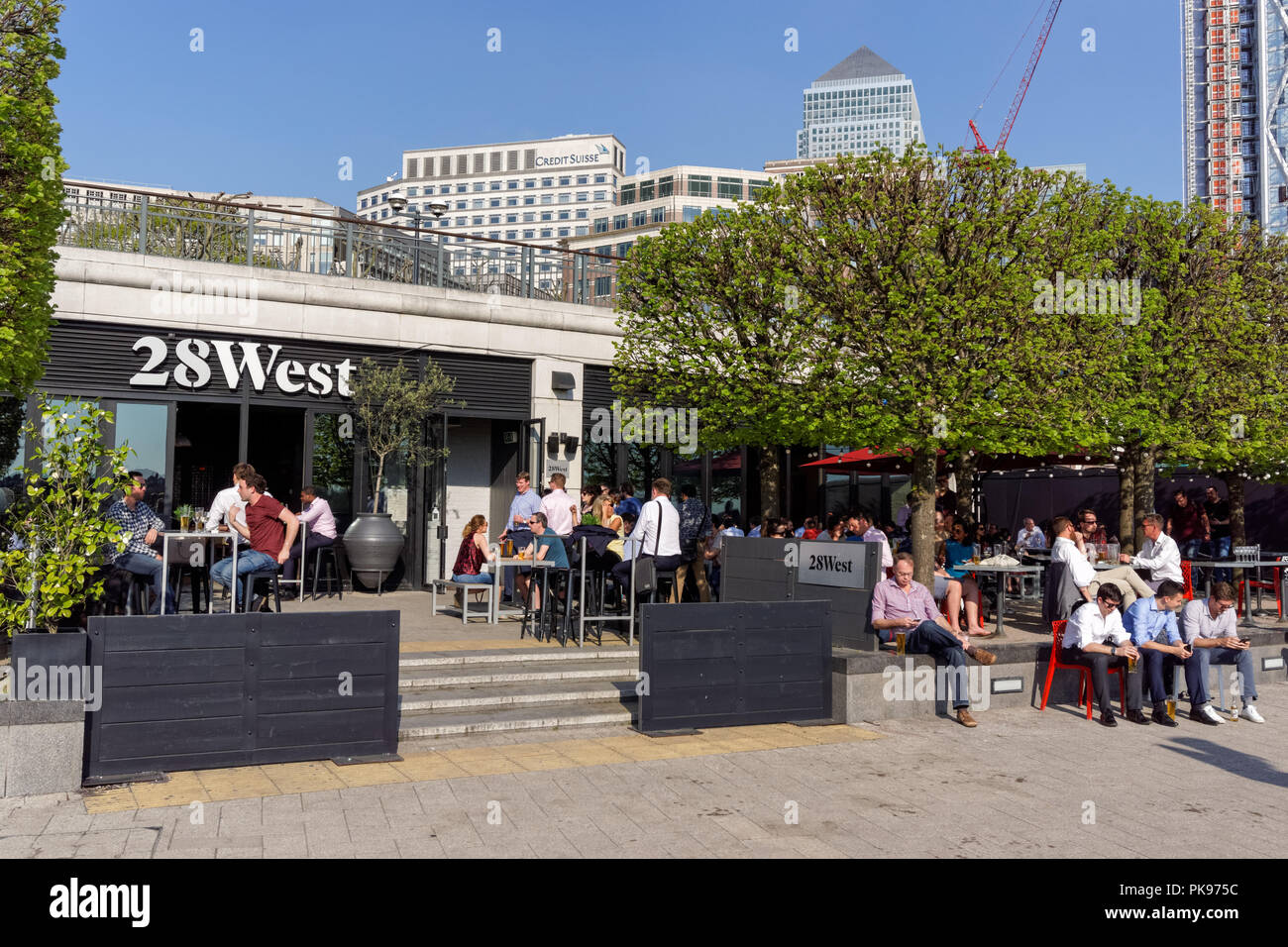 People sitting outside 28 West Bar in Canary Wharf, London England ...
