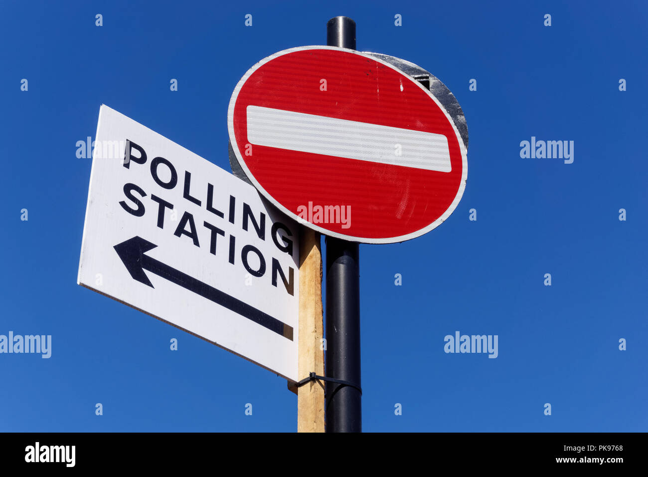 Polling station direction sign on No Entry road sign, London England ...
