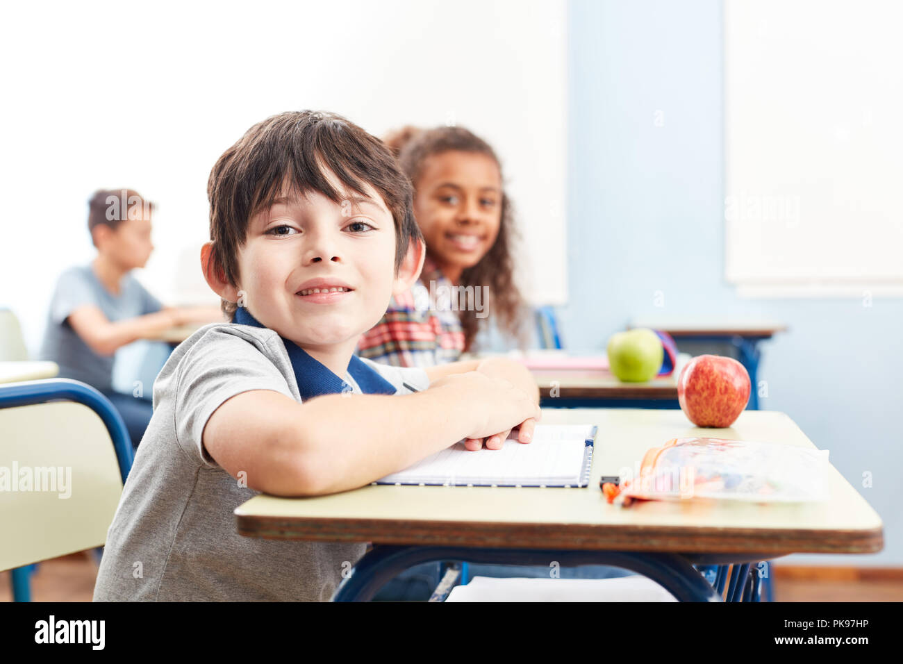 Young as a diligent student writing in elementary school Stock Photo ...