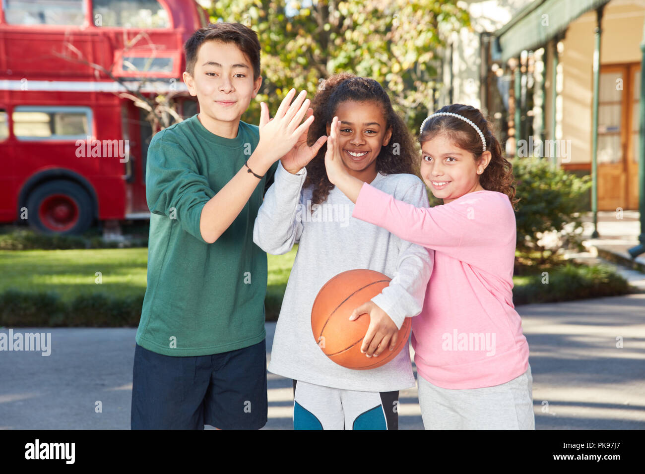 Multicultural students with basketball motivate themselves with a high ...