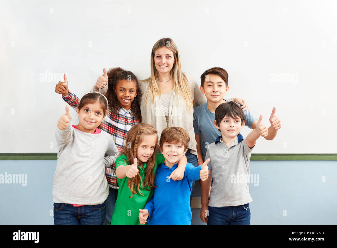 Children thumbs up group hi-res stock photography and images - Alamy