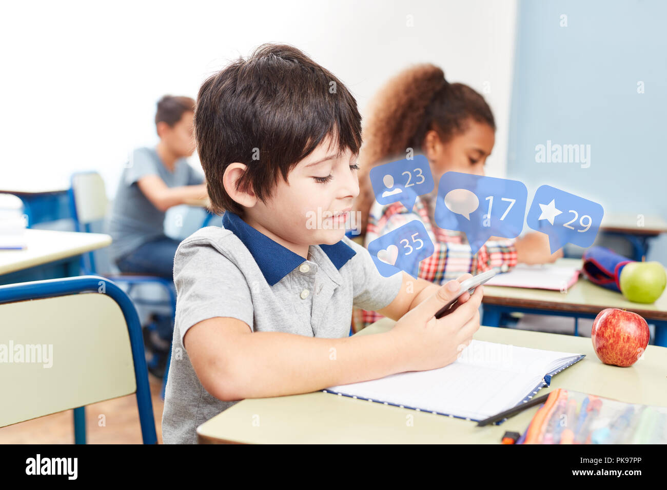 Elementary school students cell phone hi-res stock photography and ...