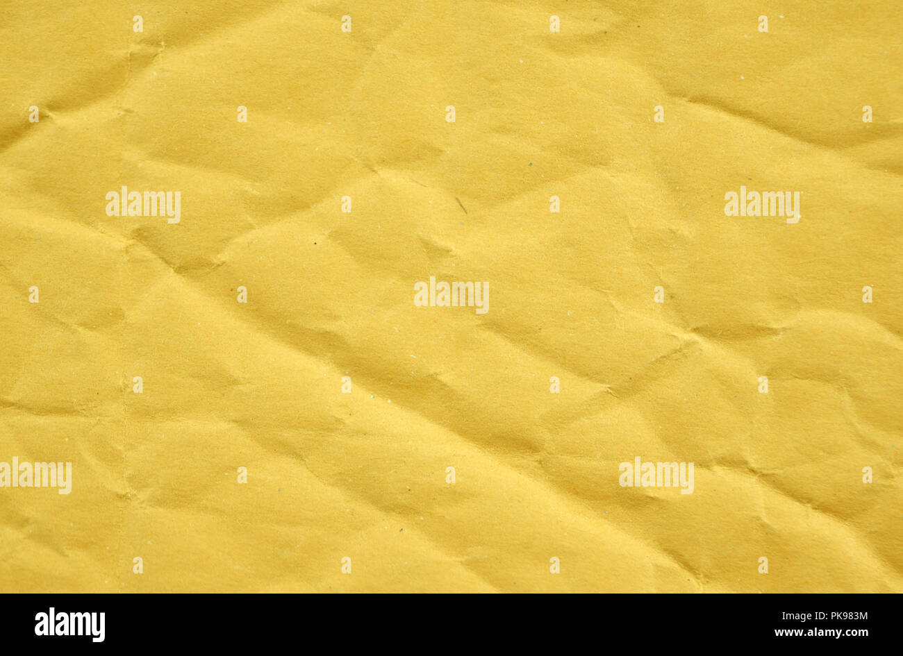 yellow crumbled paper close up texture and background Stock Photo - Alamy