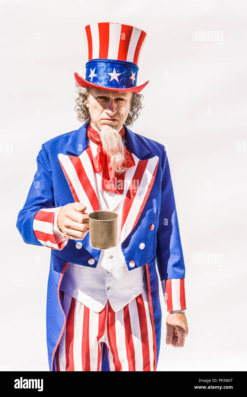Uncle Sam character appearing to be begging with a cup Stock Photo - Alamy