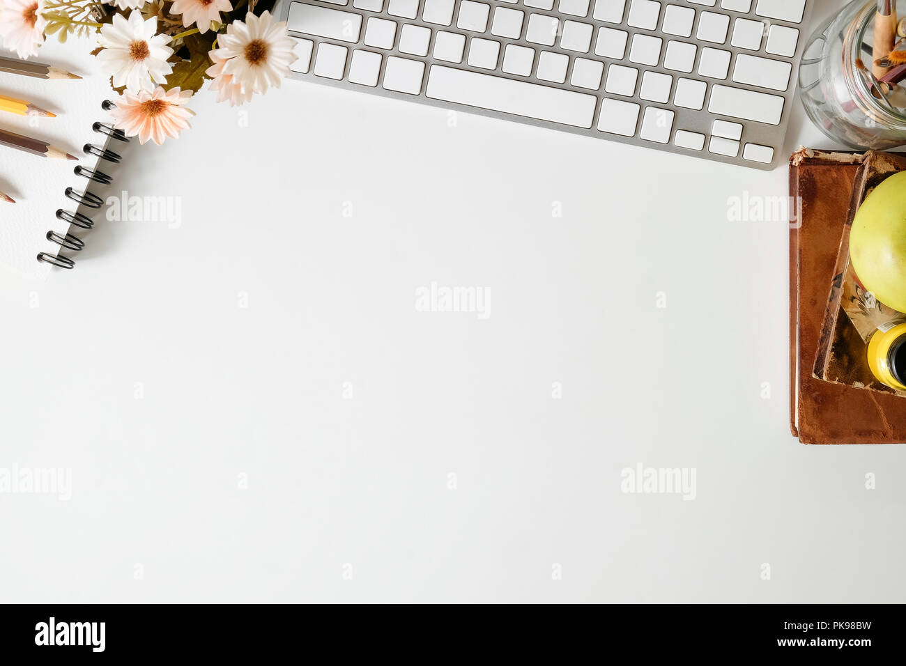 Topview office desk keyboard computer and book, colour pencil with ...