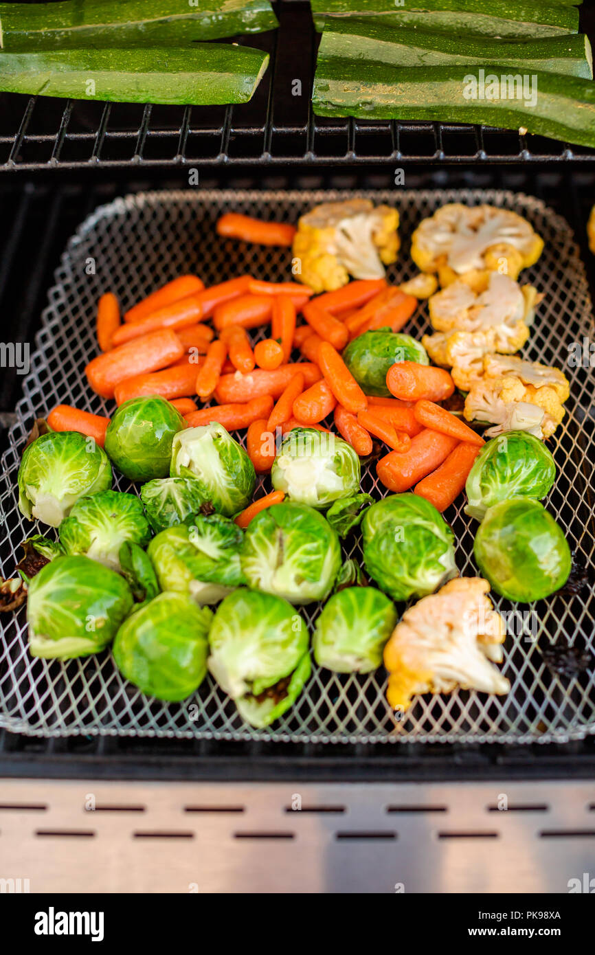 Cooking healthy dinner on outdoor gas grill Stock Photo - Alamy