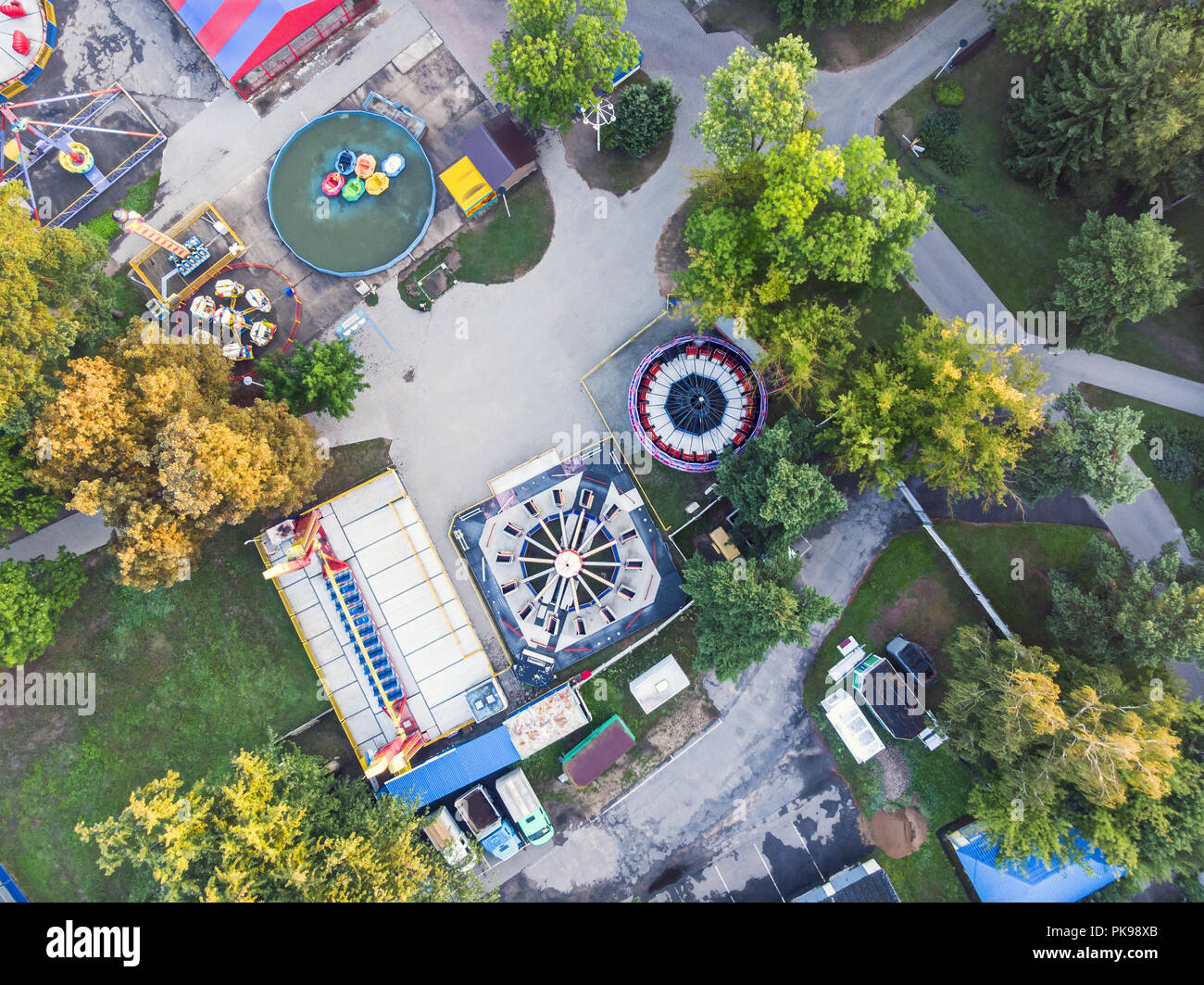 aerial top view of modern amusement park in early morning Stock Photo ...