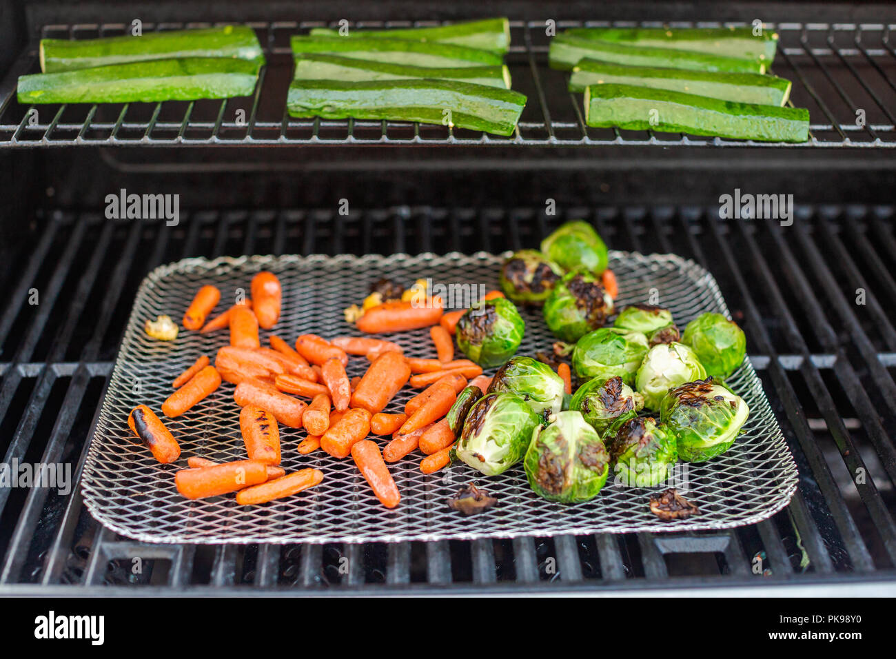 Cooking healthy dinner on outdoor gas grill Stock Photo - Alamy