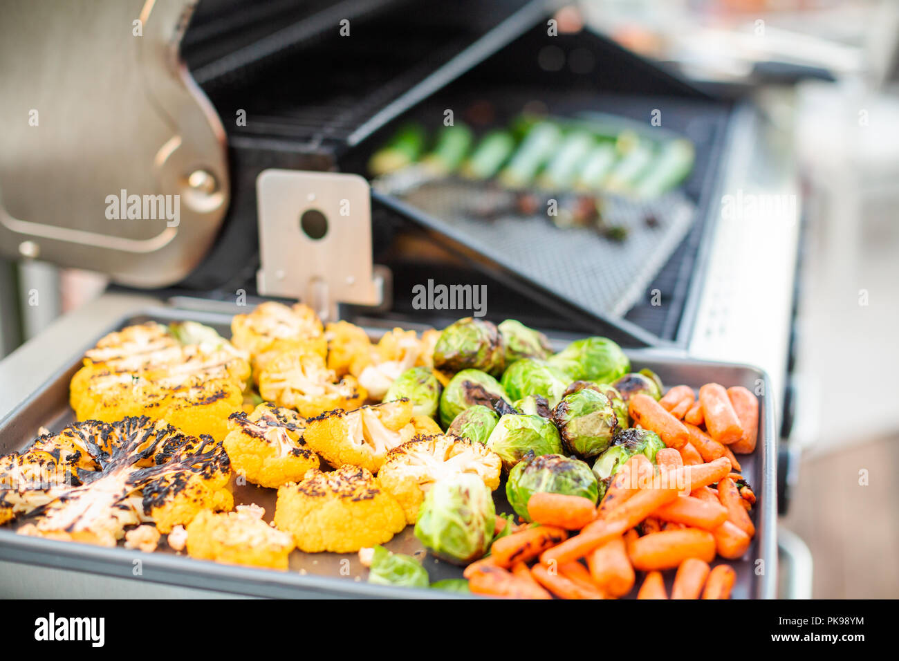 Cooking healthy dinner on outdoor gas grill Stock Photo - Alamy