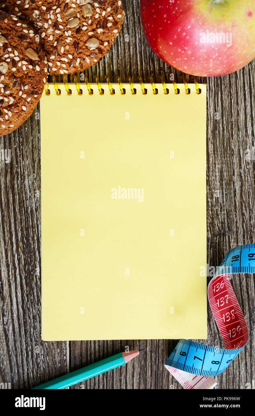 The concept of healthy eating. Diet symbol - apples, cereal cookies and ...