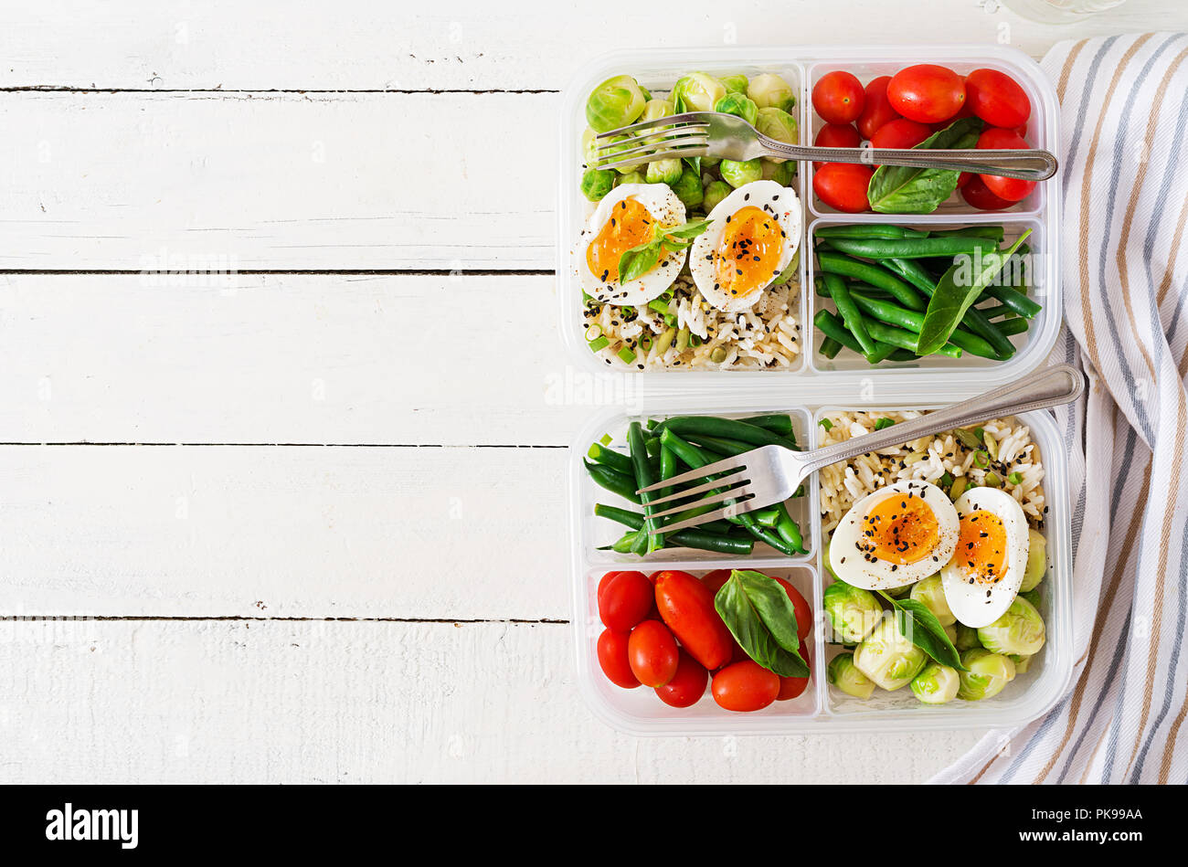 Vegetarian meal prep containers with eggs, brussel sprouts, green beans ...