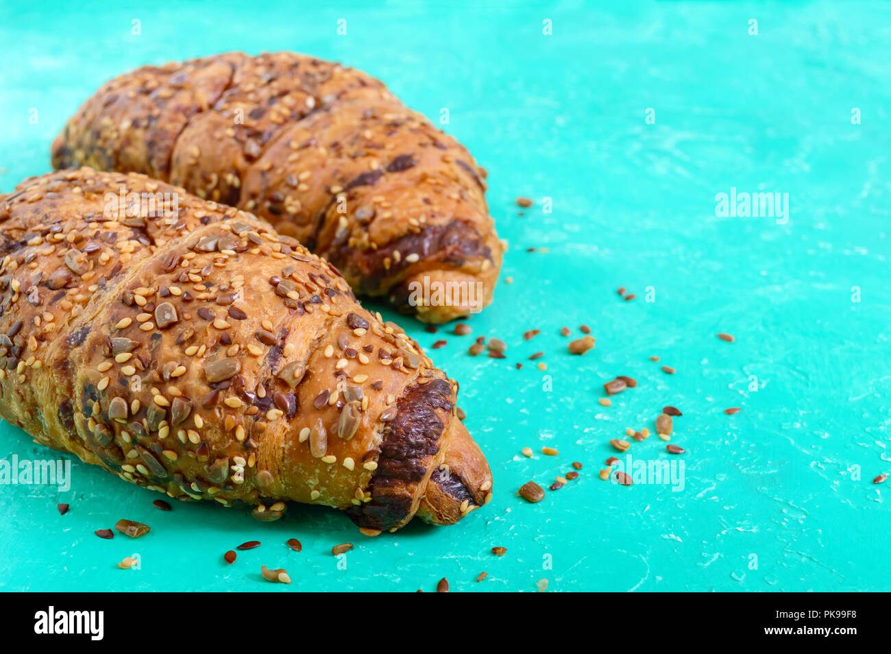 French grain croissants on a bright background. The concept of healthy ...