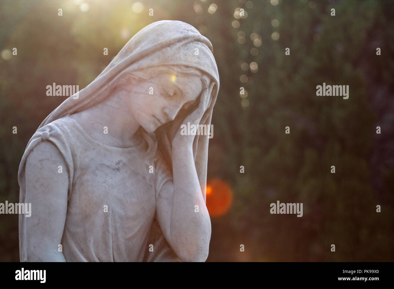 Vintage tombstones statue of women. The marble monument a beautiful ...