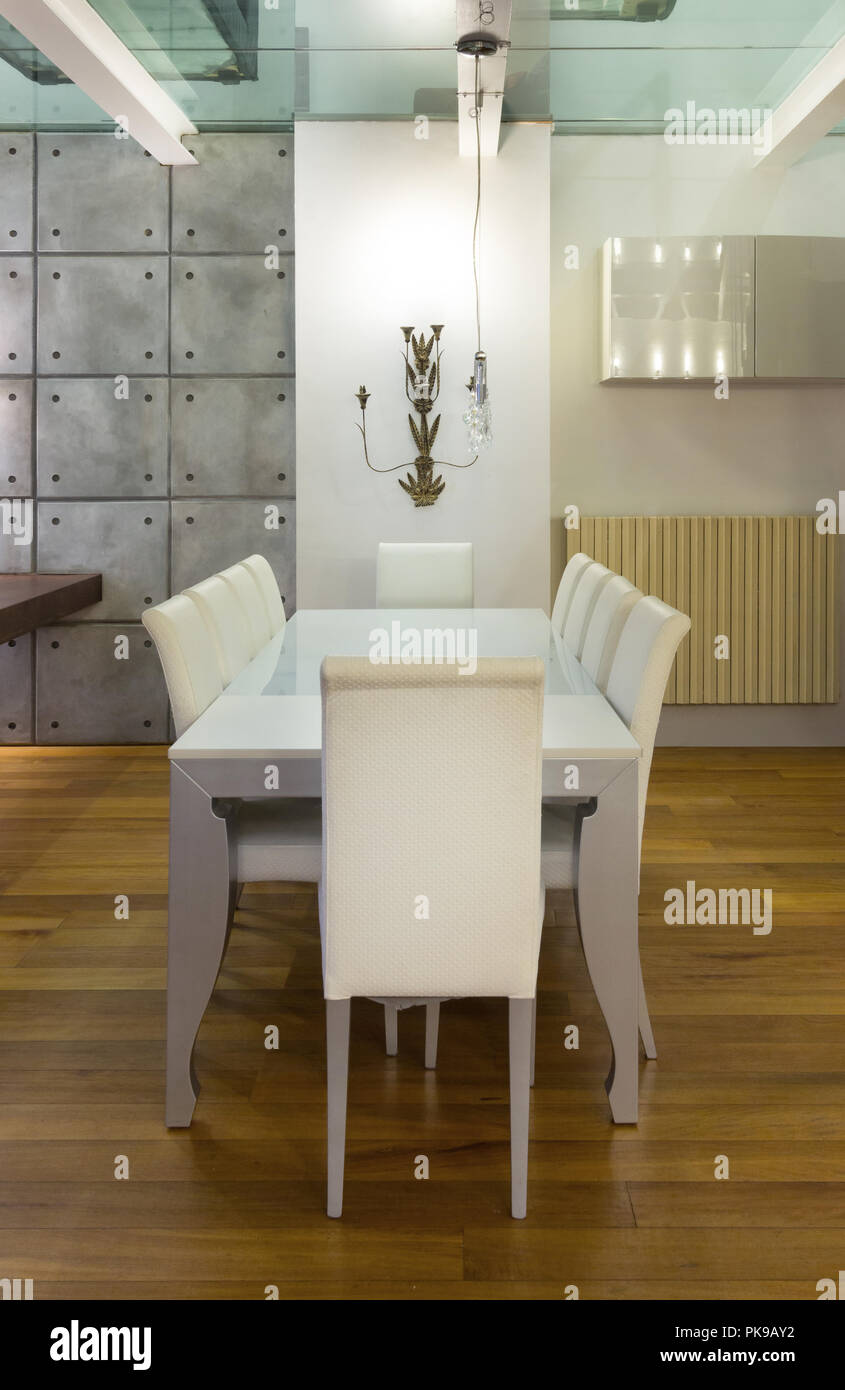 Architecture, wide loft with modern furniture, dining table Stock Photo ...