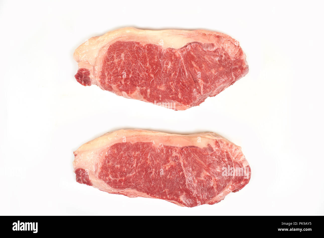 fresh raw steak isolated on white background Stock Photo - Alamy