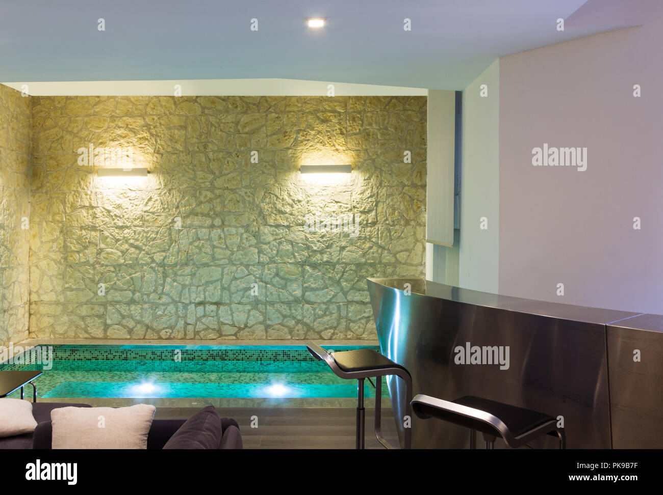 modern hotel spa interior, hot tub, stone wall Stock Photo - Alamy