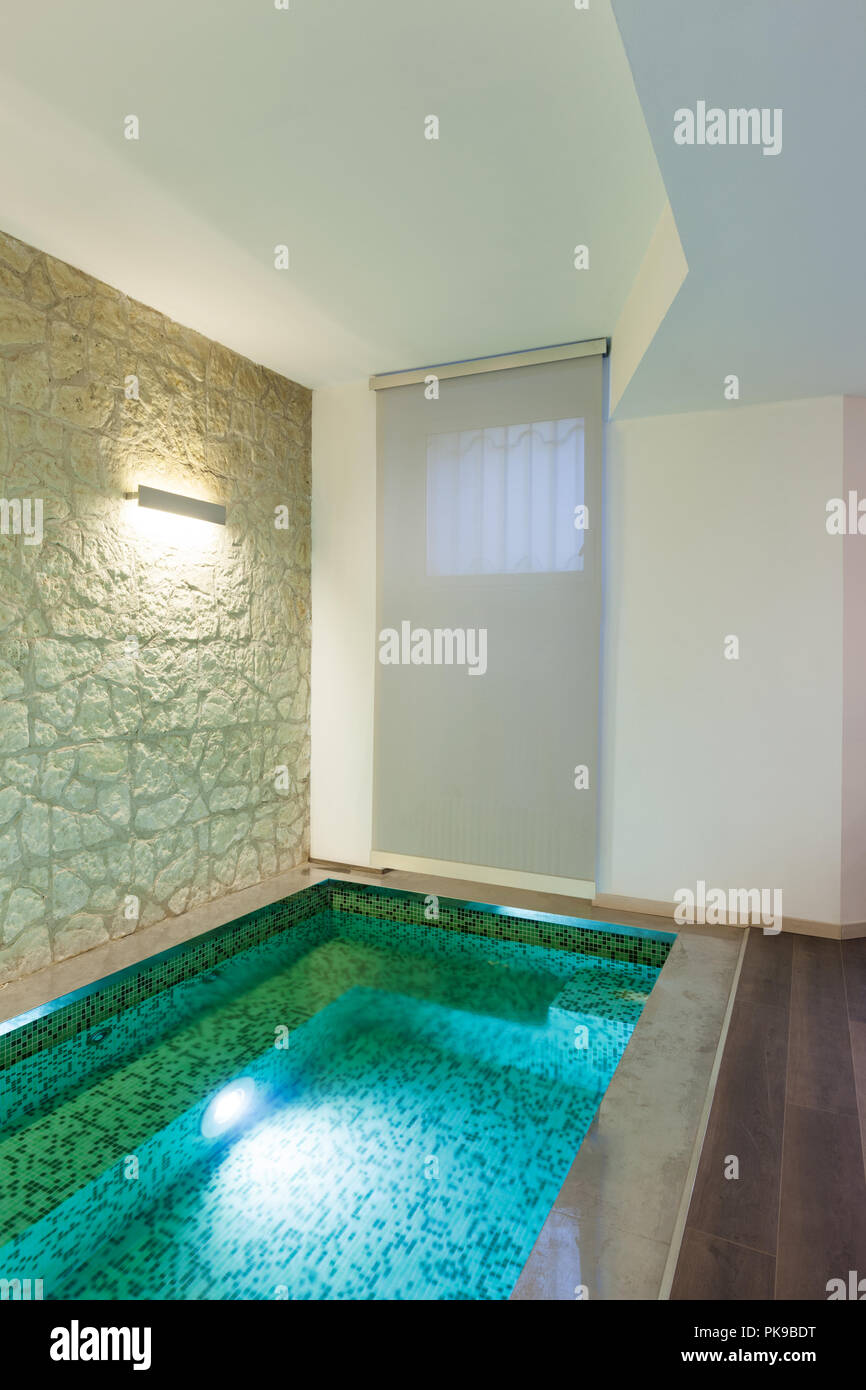 modern hotel spa interior, hot tub, stone wall Stock Photo - Alamy