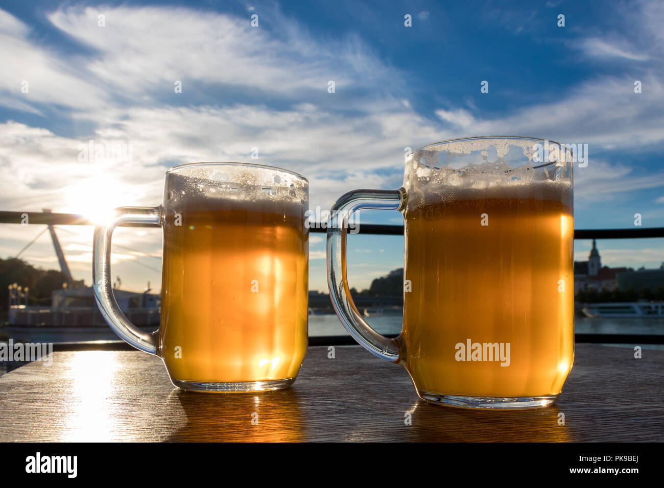 Close-up two cold beers with foam and water drops on the background ...