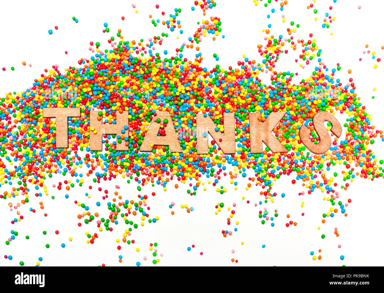 The word THANKS from wooden letters and abstract background from ...