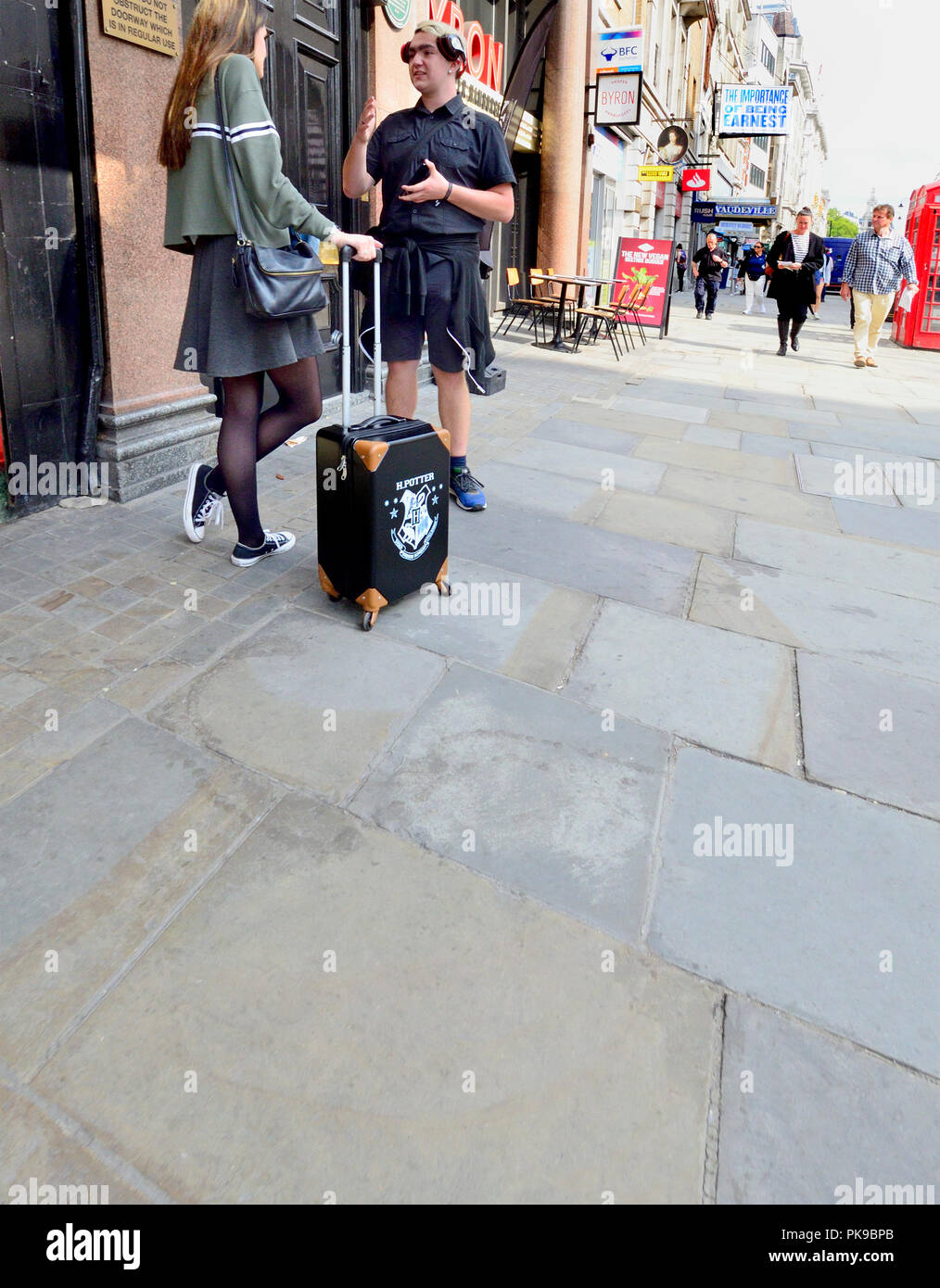 Young people talking in the Strand, London, England, UK Stock Photo - Alamy