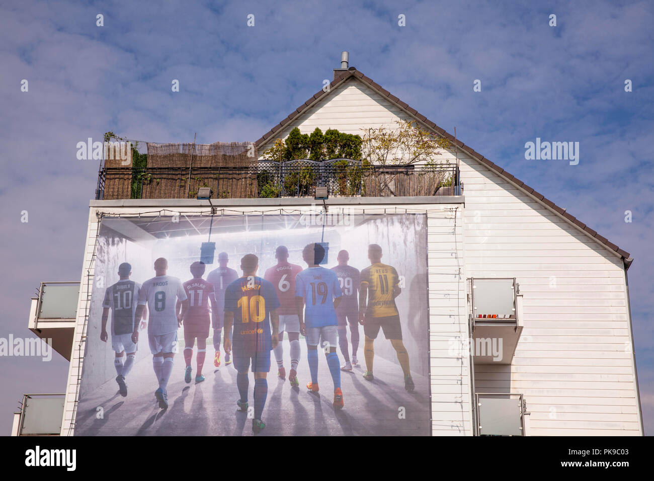 advertisement on a apartment house in the district Ehrenfeld, Cologne ...