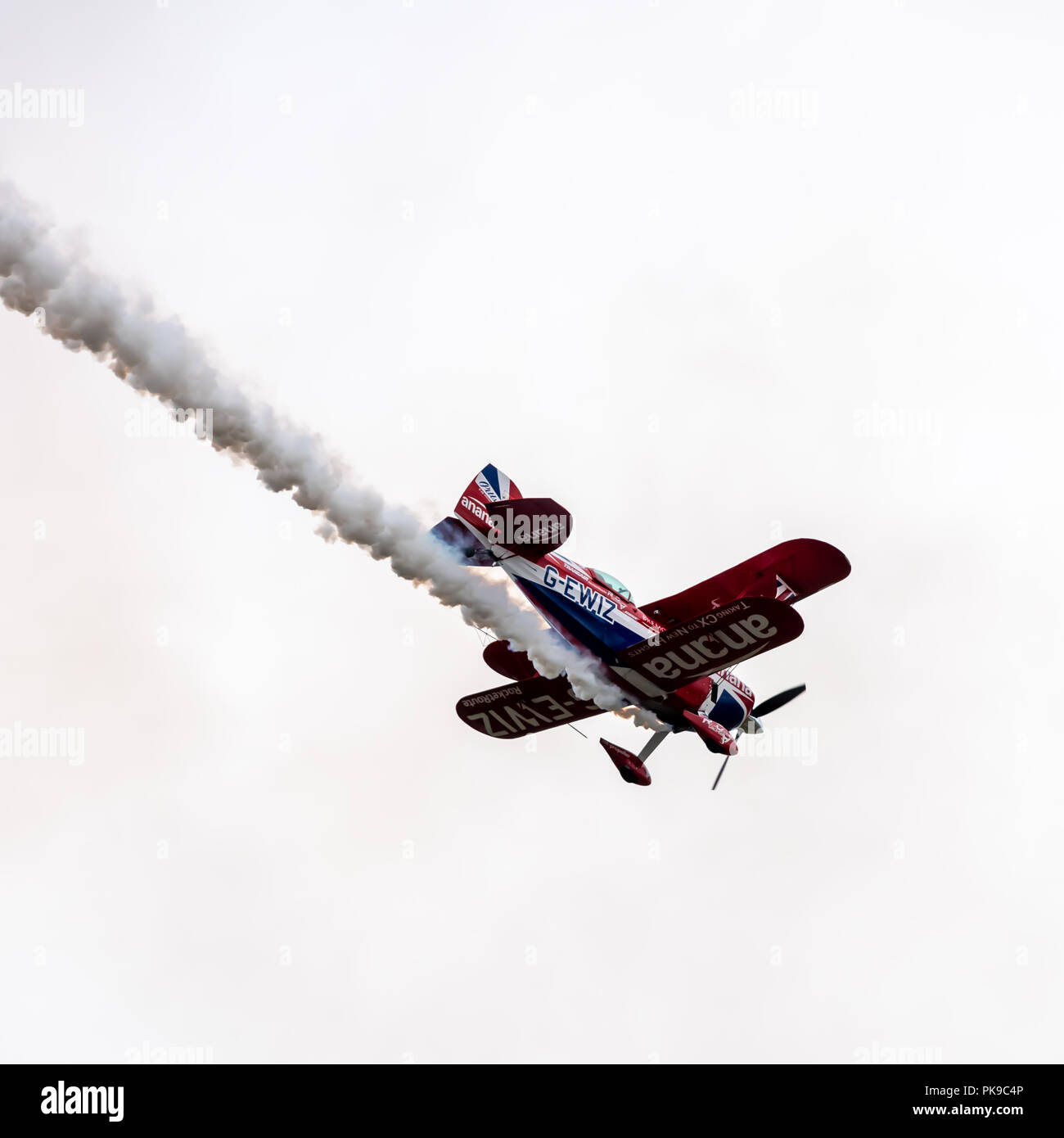 Flying white aerobatic plane hi-res stock photography and images - Alamy