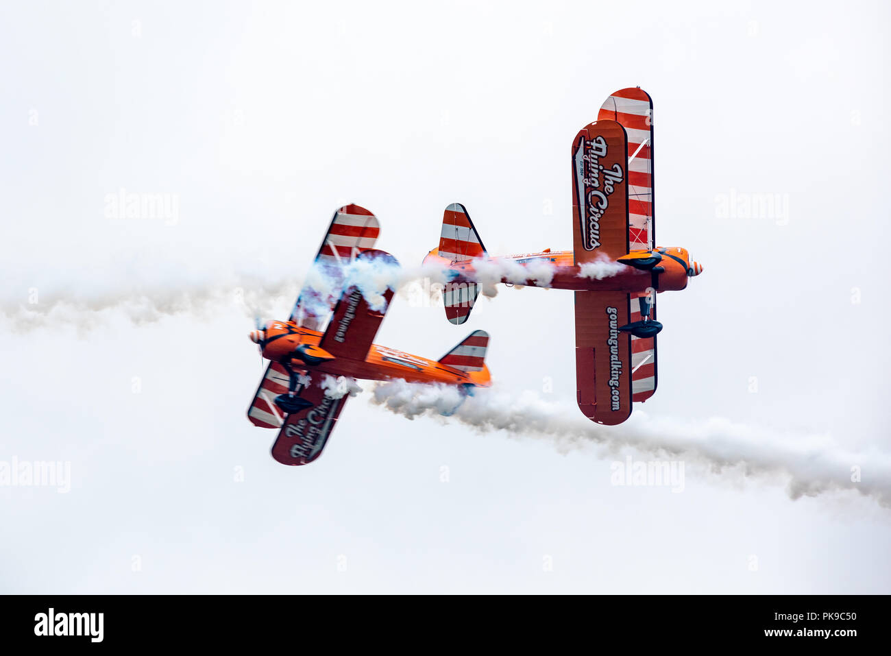Boeing Stearman biplanes from the AeroSuperBatics Flying Circus perform ...