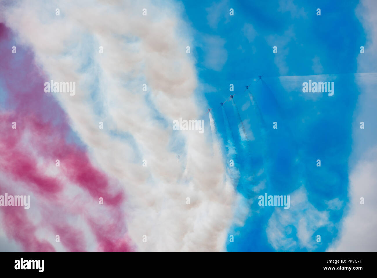 Red Arrows Hawk T1 jets climb into the sky partly obscured by their ...