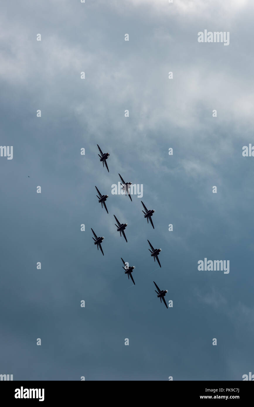 Red Arrows Hawk T1 jets in their Diamond Nine formation against a ...