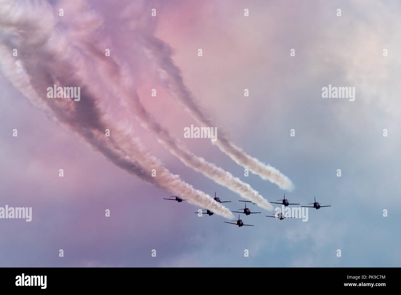 Red arrows with smoke trails hi-res stock photography and images - Alamy