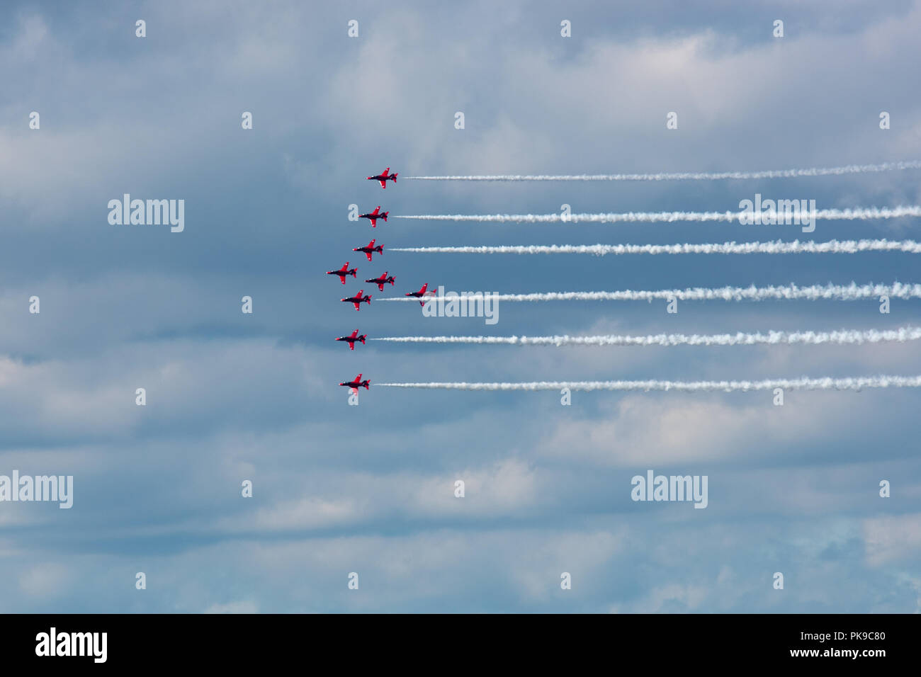 The RAF's Red Arrows display team in "Lightning" formation against a ...