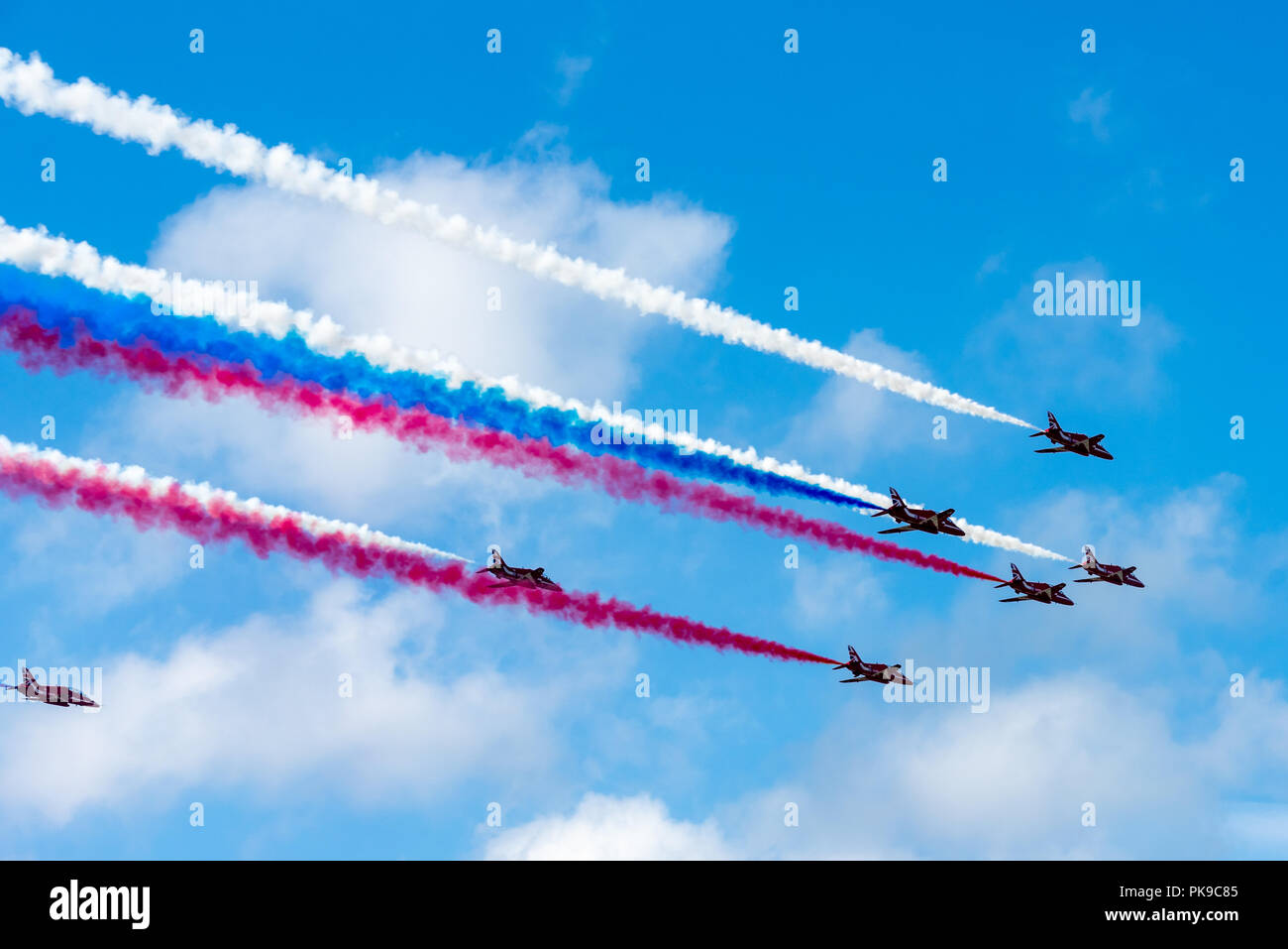 Red Arrows Hawk jets with their signature red, white and blue smoke ...