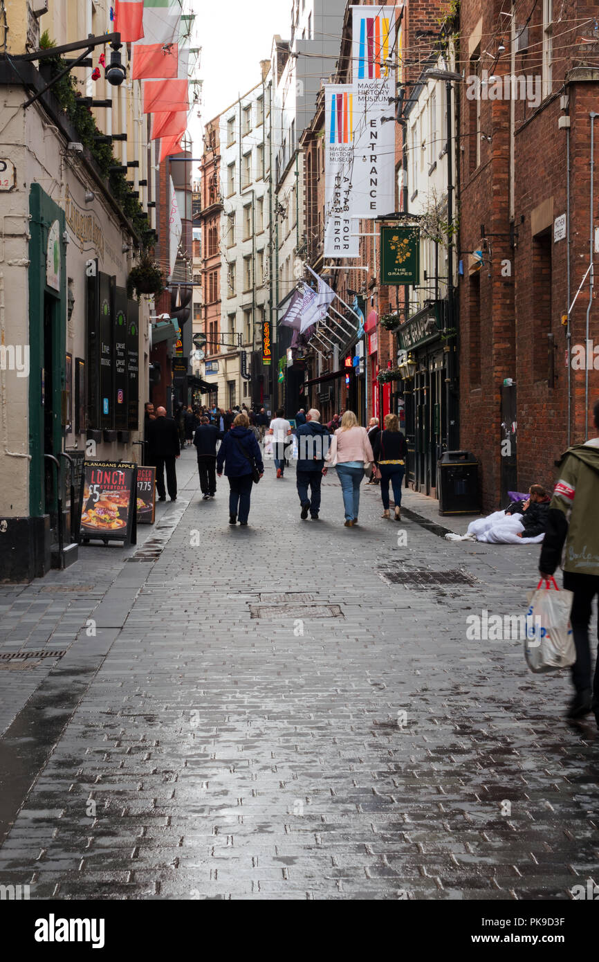 People walking down the famous Mathew St in Liverpool UK. Which is home ...
