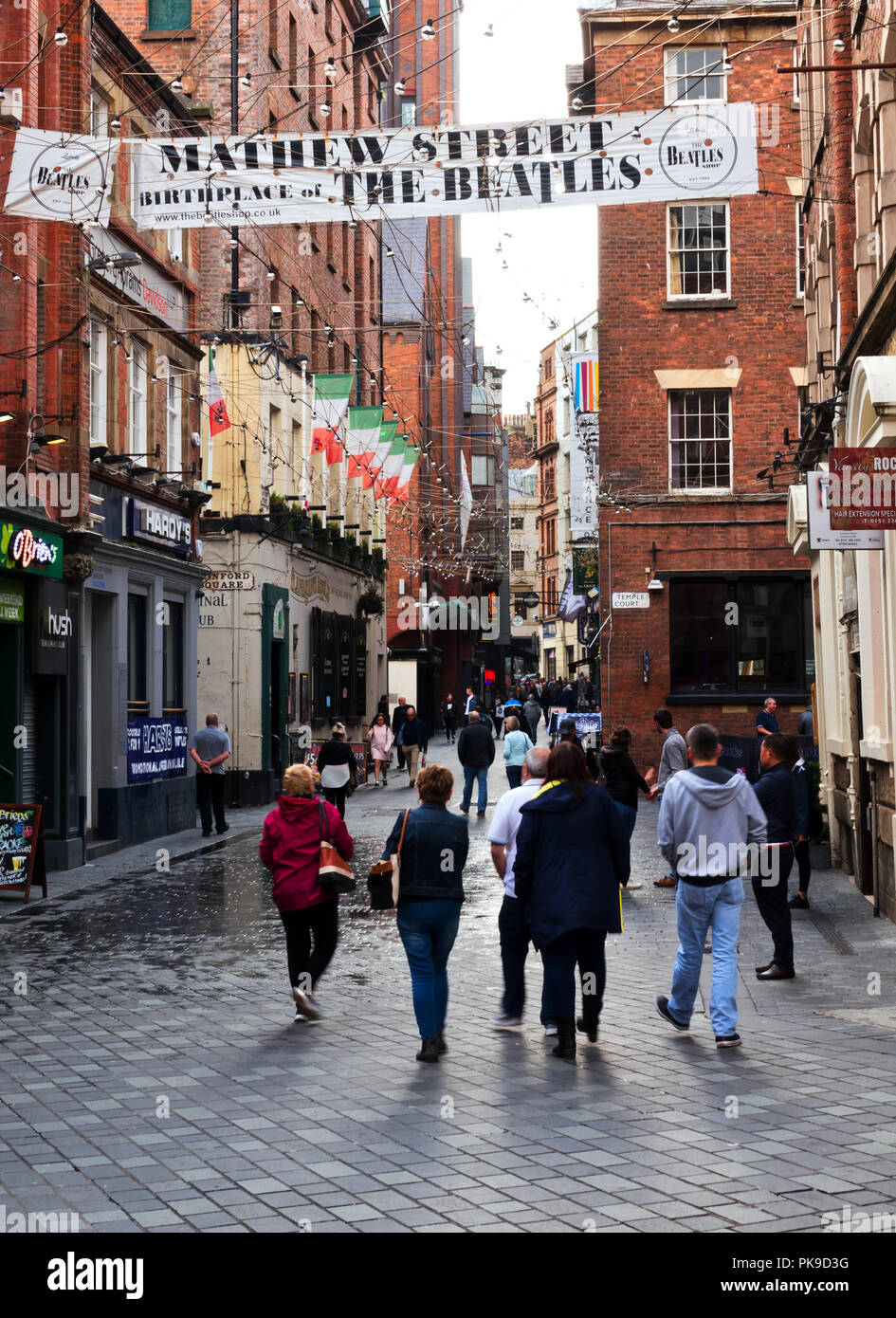 People walking down the famous Mathew St in Liverpool UK. Which is home ...