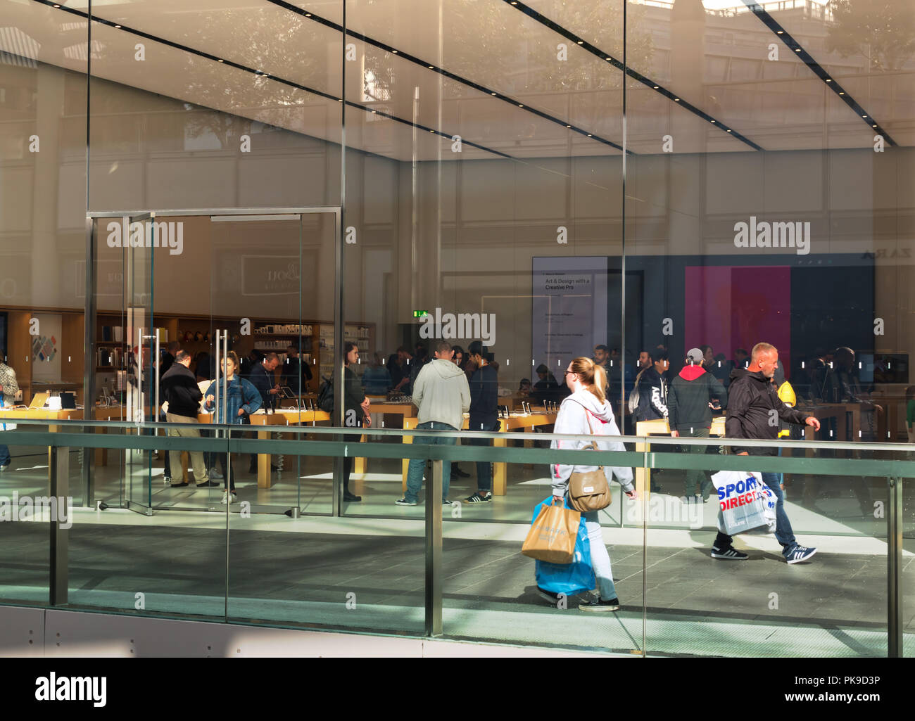 People inside browsing the products at the Apple store in Liverpool One ...
