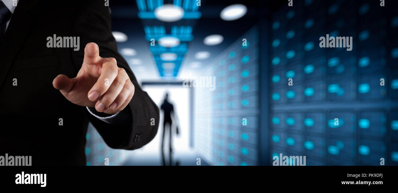 Businessman working with VR wide blank screen computer on server room ...