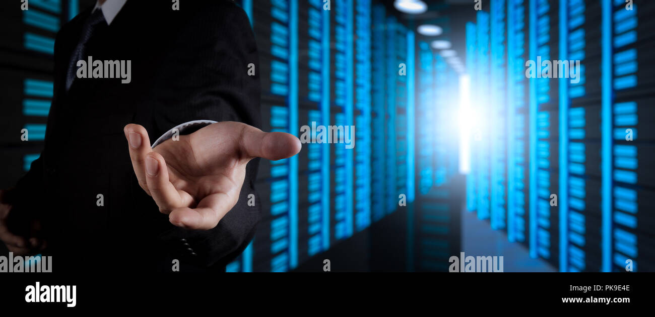 Businessman working with VR wide blank screen computer on server room ...