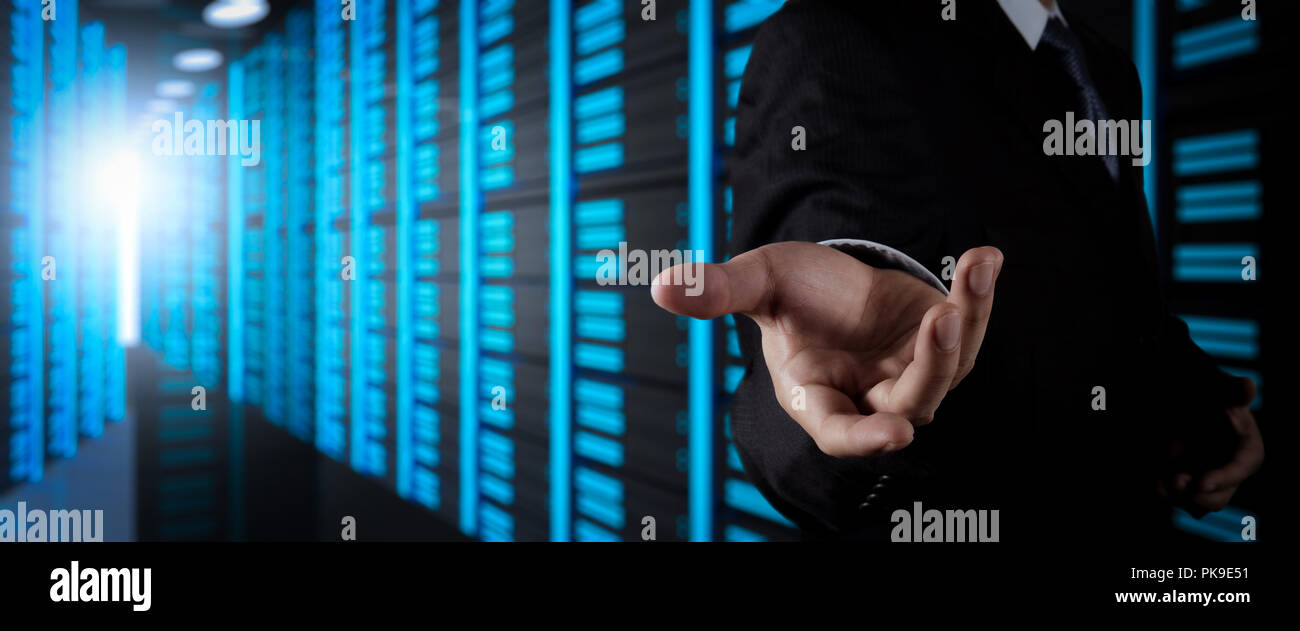 Businessman working with VR wide blank screen computer on server room ...