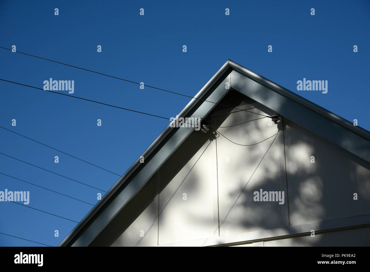 electricity power supply cables arriving at a small country house in ...