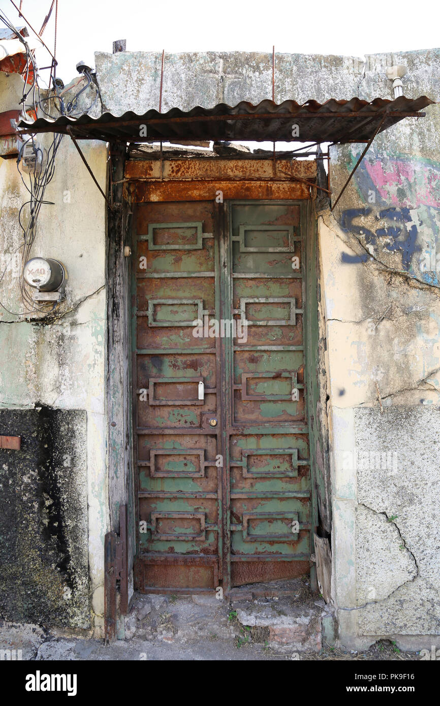 Green street door Stock Photo - Alamy