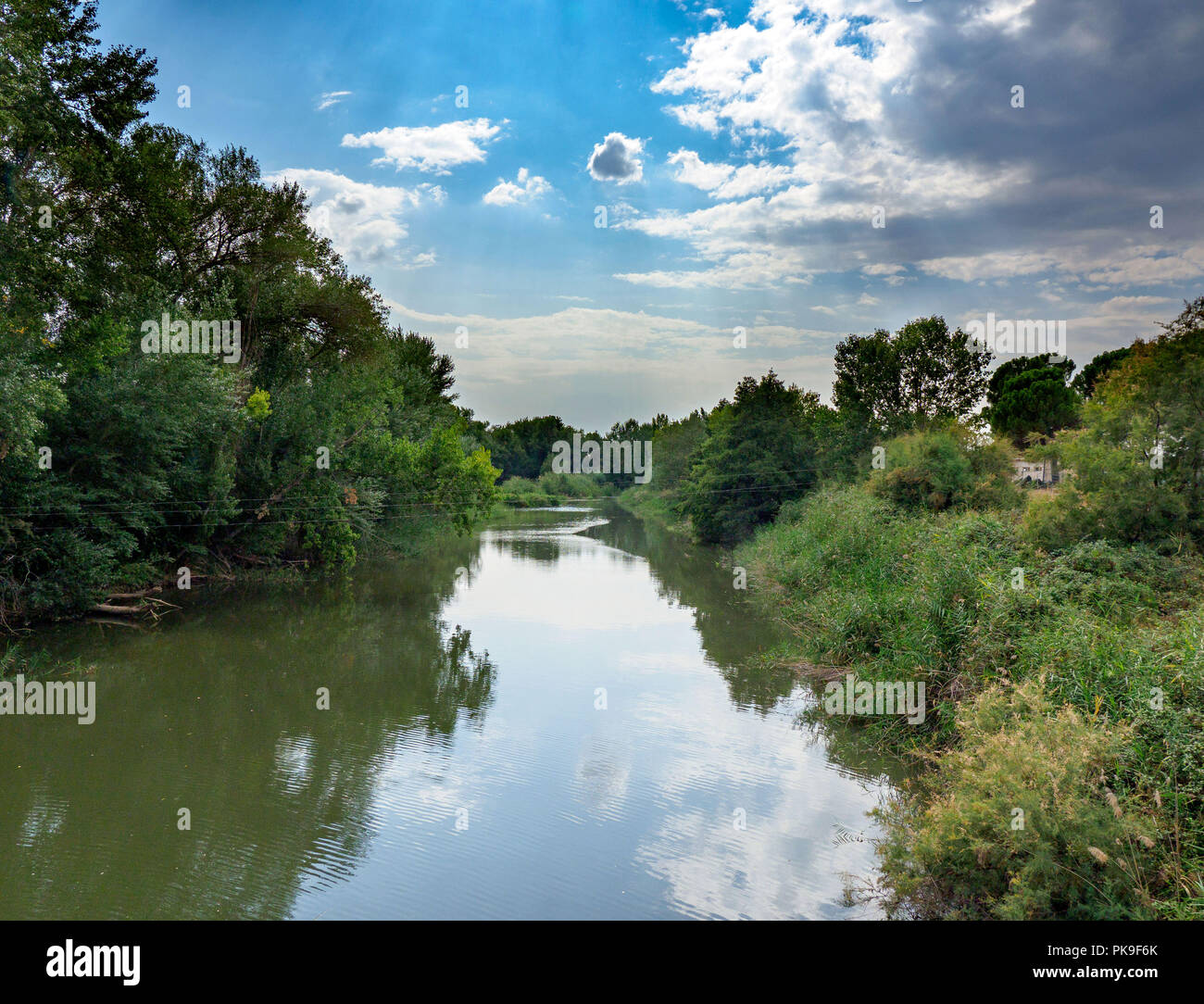 Henares river on its way through the city of Alcala de Henares in Spain ...