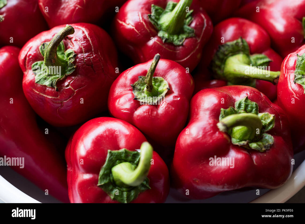 Whole Red Peppers in White Bowl. Close Up View. Organic Food Stock ...